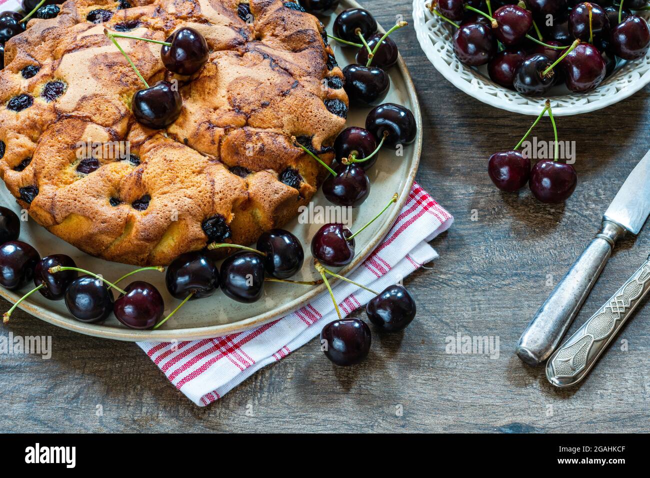 Black cherry sponge cake - high angle view Stock Photo - Alamy