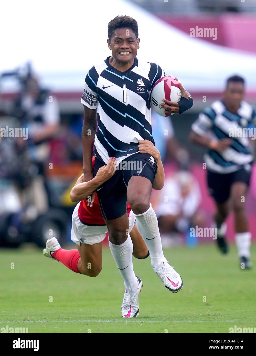 Fiji's Vasiti Solikoviti is tackled by Great Britain's Emma Uren during ...