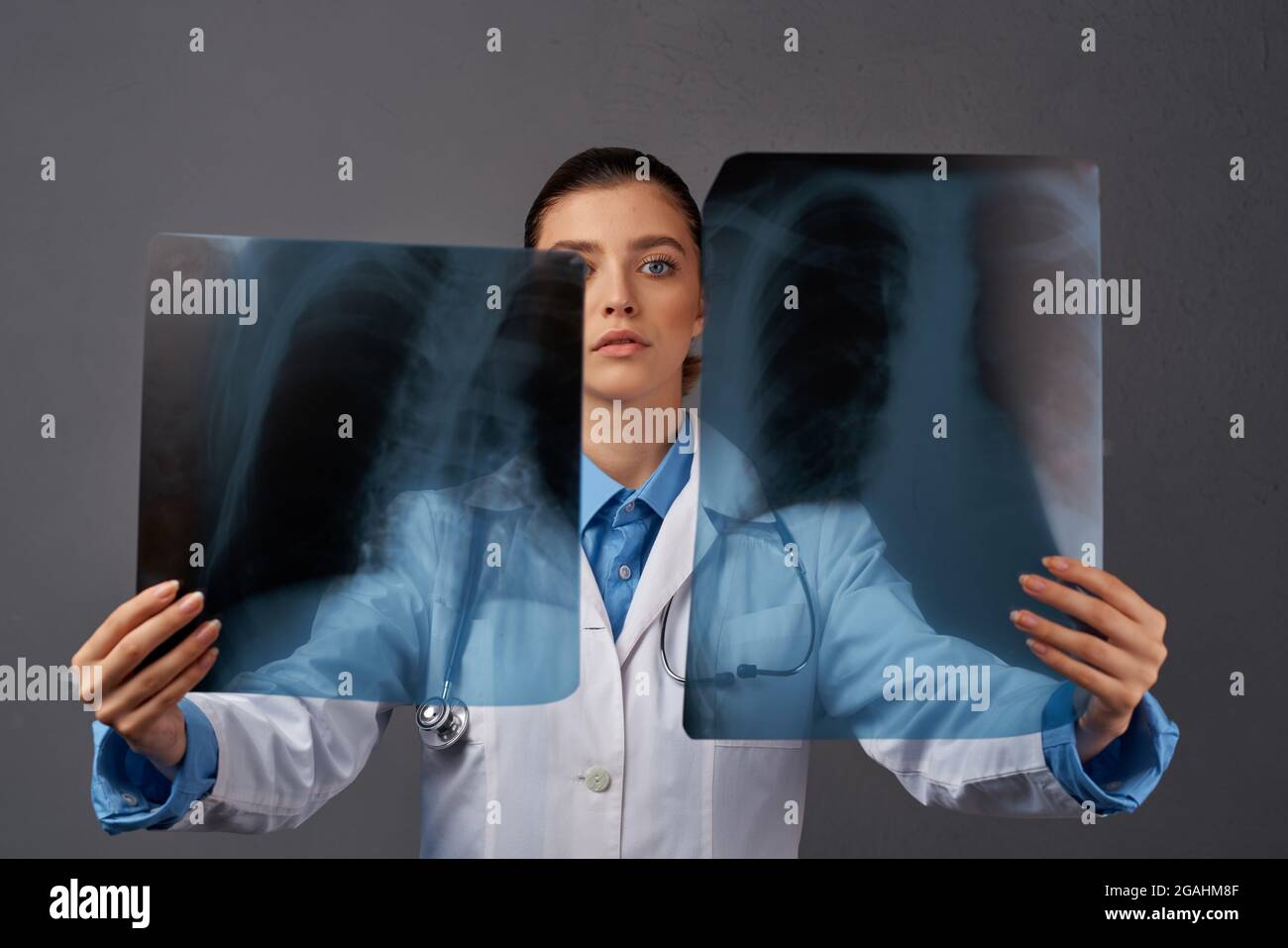 Woman in white coat radiologist professional Stock Photo - Alamy