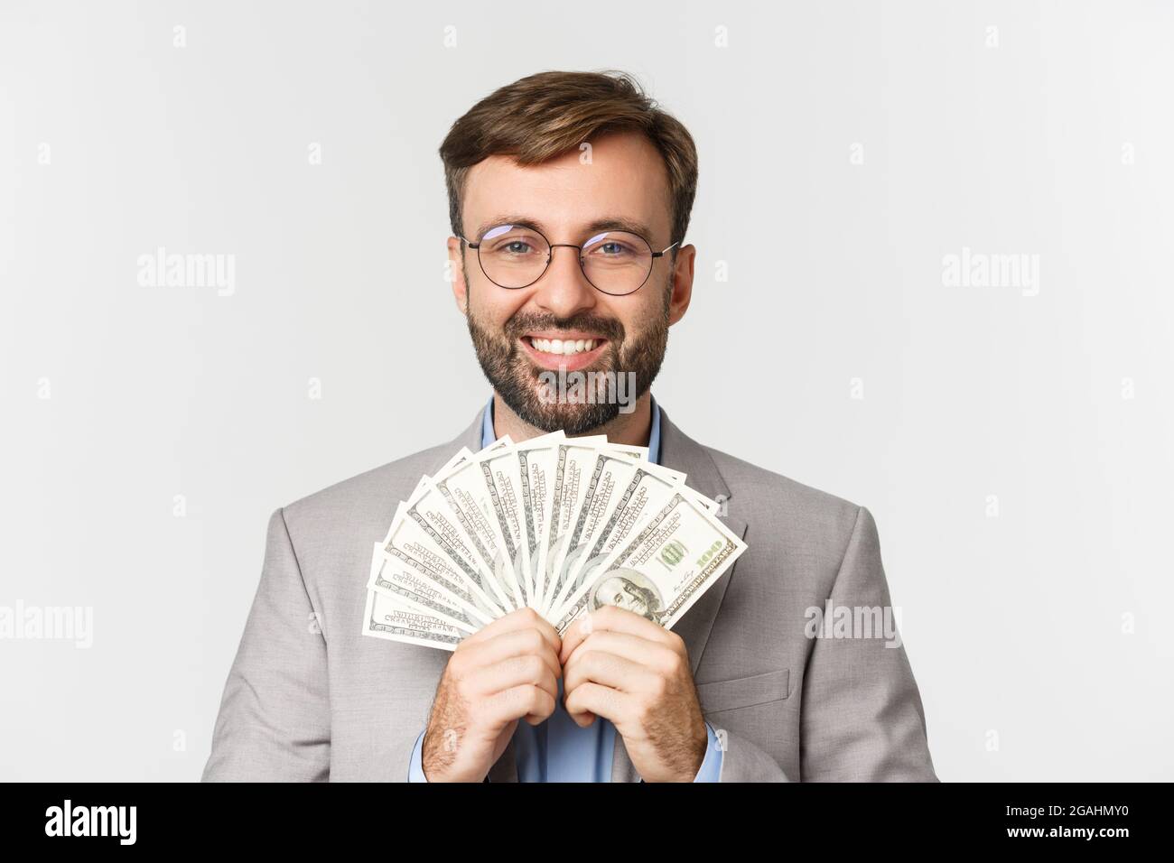 Close-up of rich and successful businessman, wearing gray suit and ...