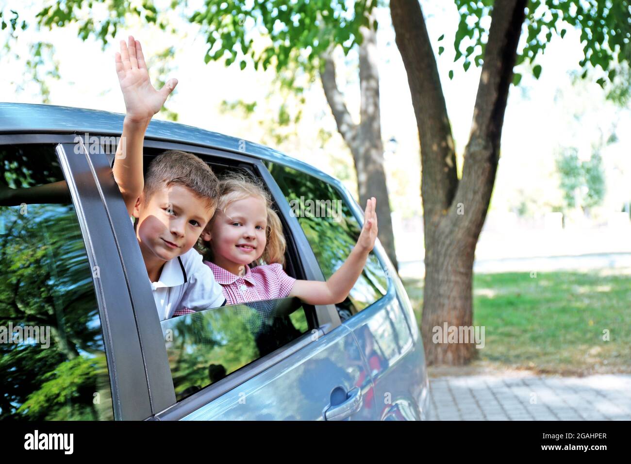 Smiling children in the car Stock Photo - Alamy