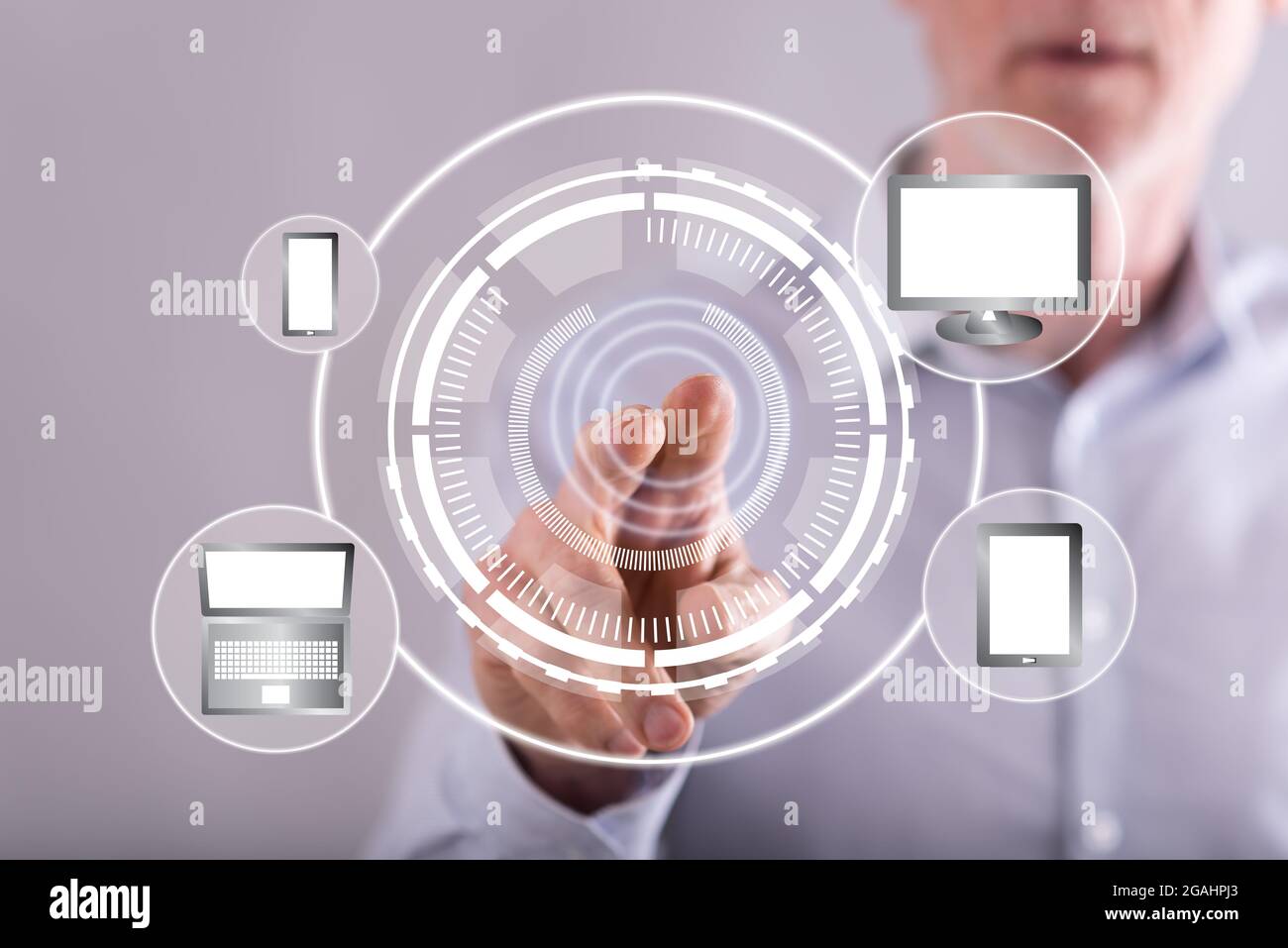 Man touching a device connection concept on a touch screen with his ...