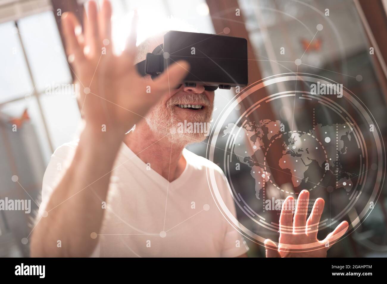 Senior man using a virtual reality headset, double exposure, light ...