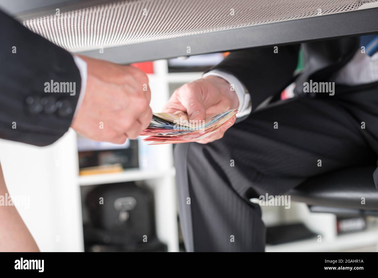 Money under the table hi-res stock photography and images - Alamy