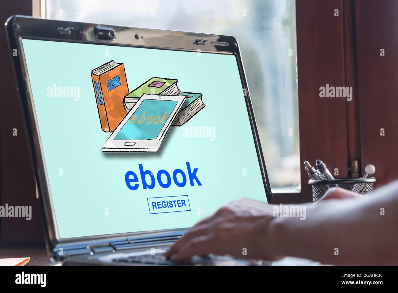 Laptop screen displaying an e-book concept Stock Photo - Alamy