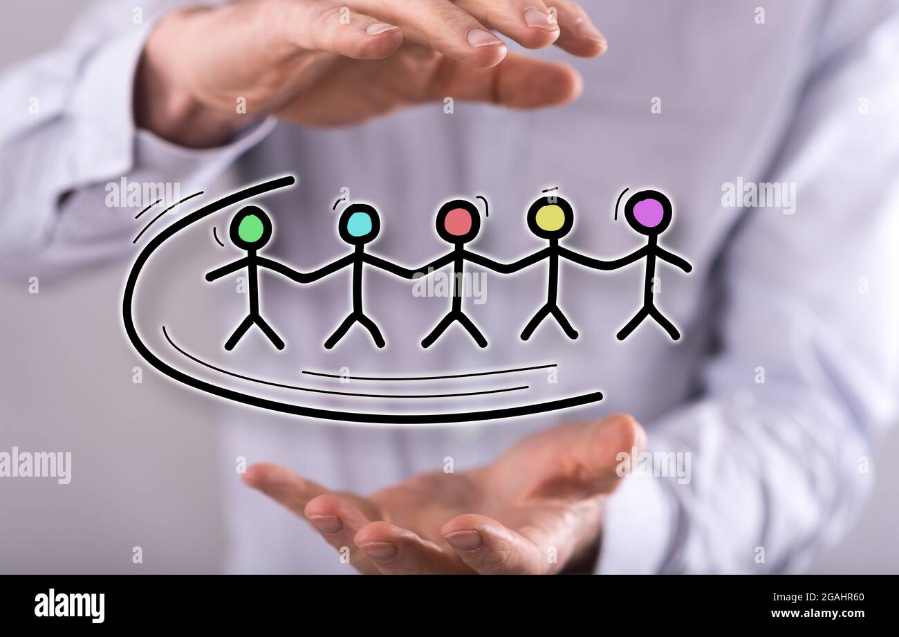 Teamwork concept between hands of a man in background Stock Photo - Alamy