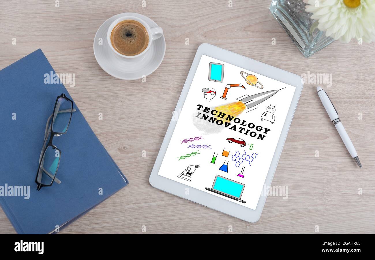 Top view of a desk with technology innovation concept on a digital ...