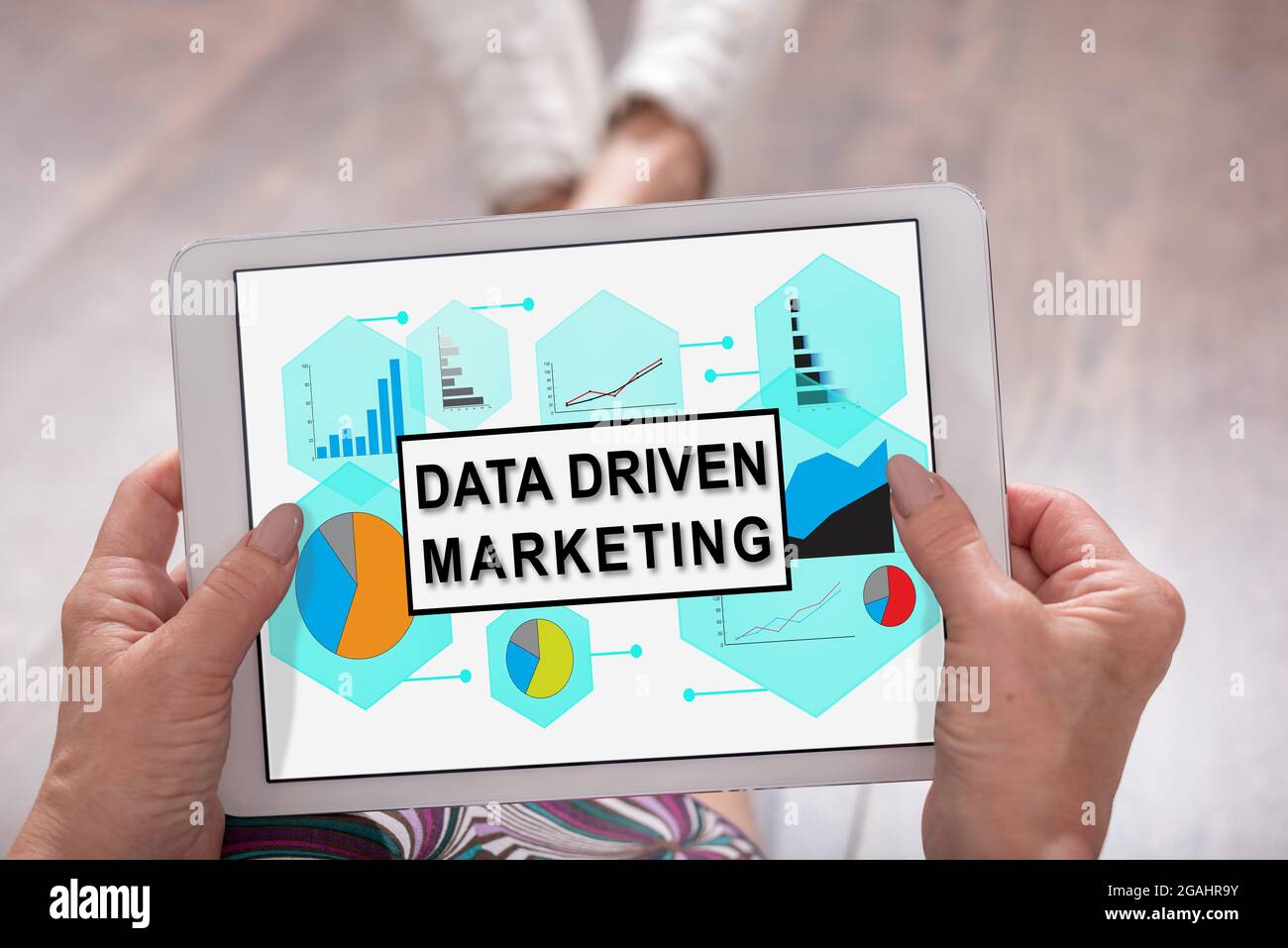 Data driven marketing concept shown on a tablet held by a woman Stock ...