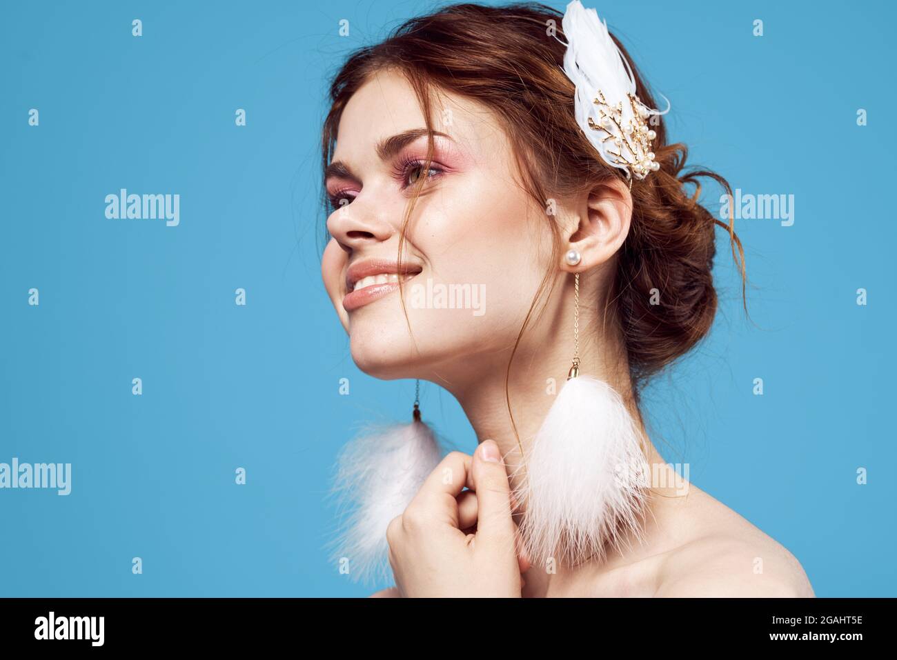 pretty woman fluffy earrings bright makeup cropped view model Stock ...