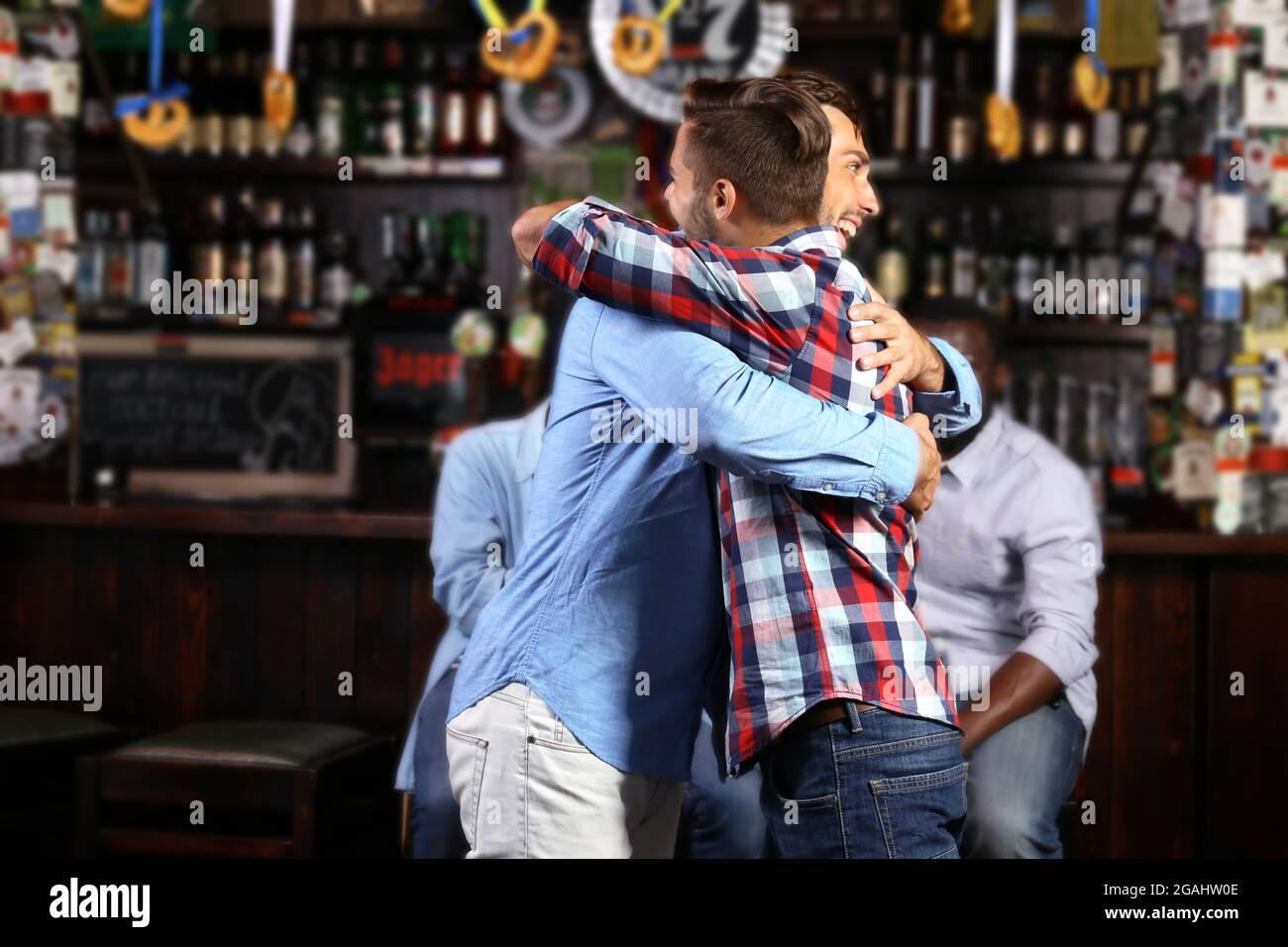 Young people having fun in a bar Stock Photo - Alamy