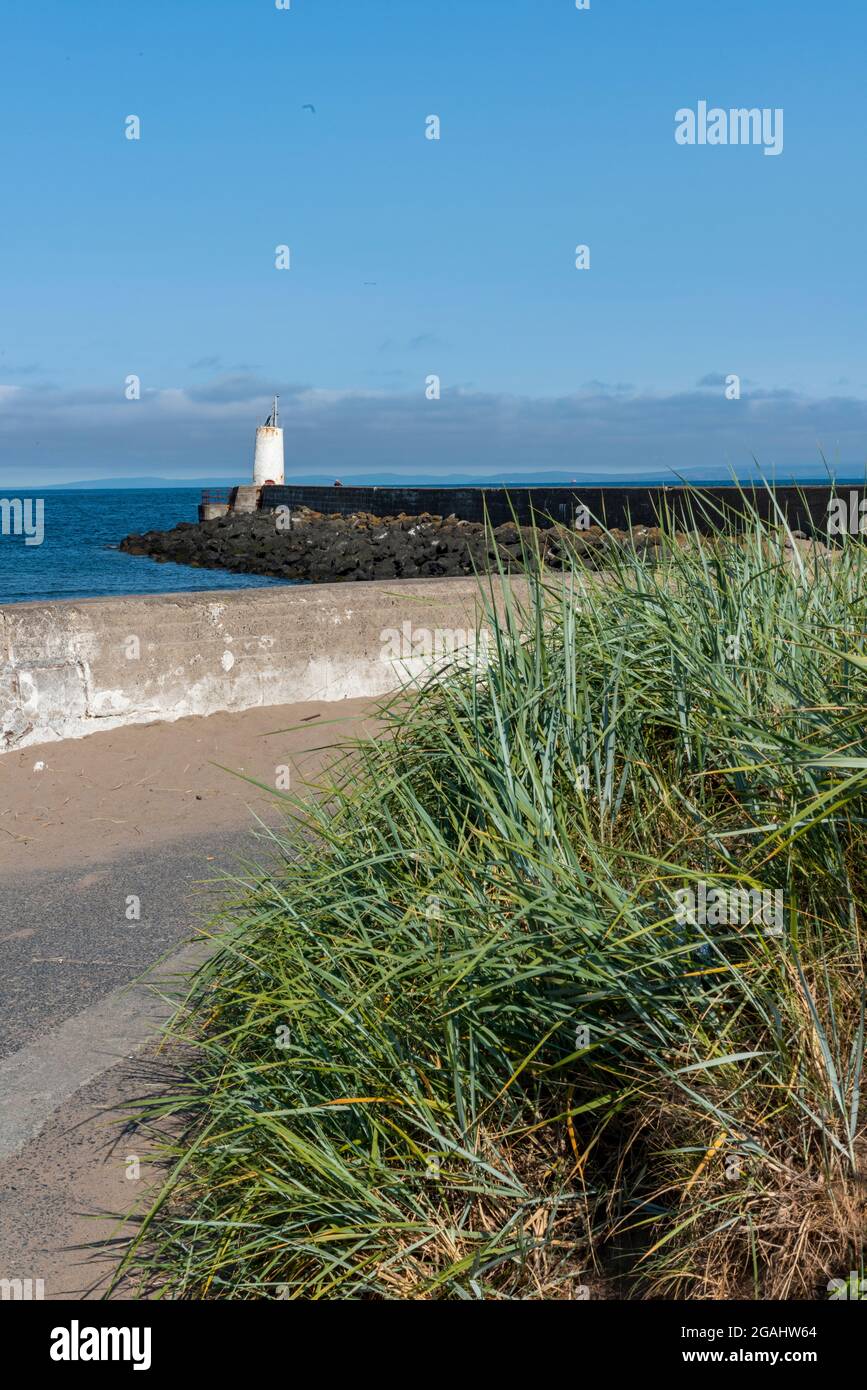 harbour entrance with lighthouse at girvan in ayrshire, scotland, uk ...