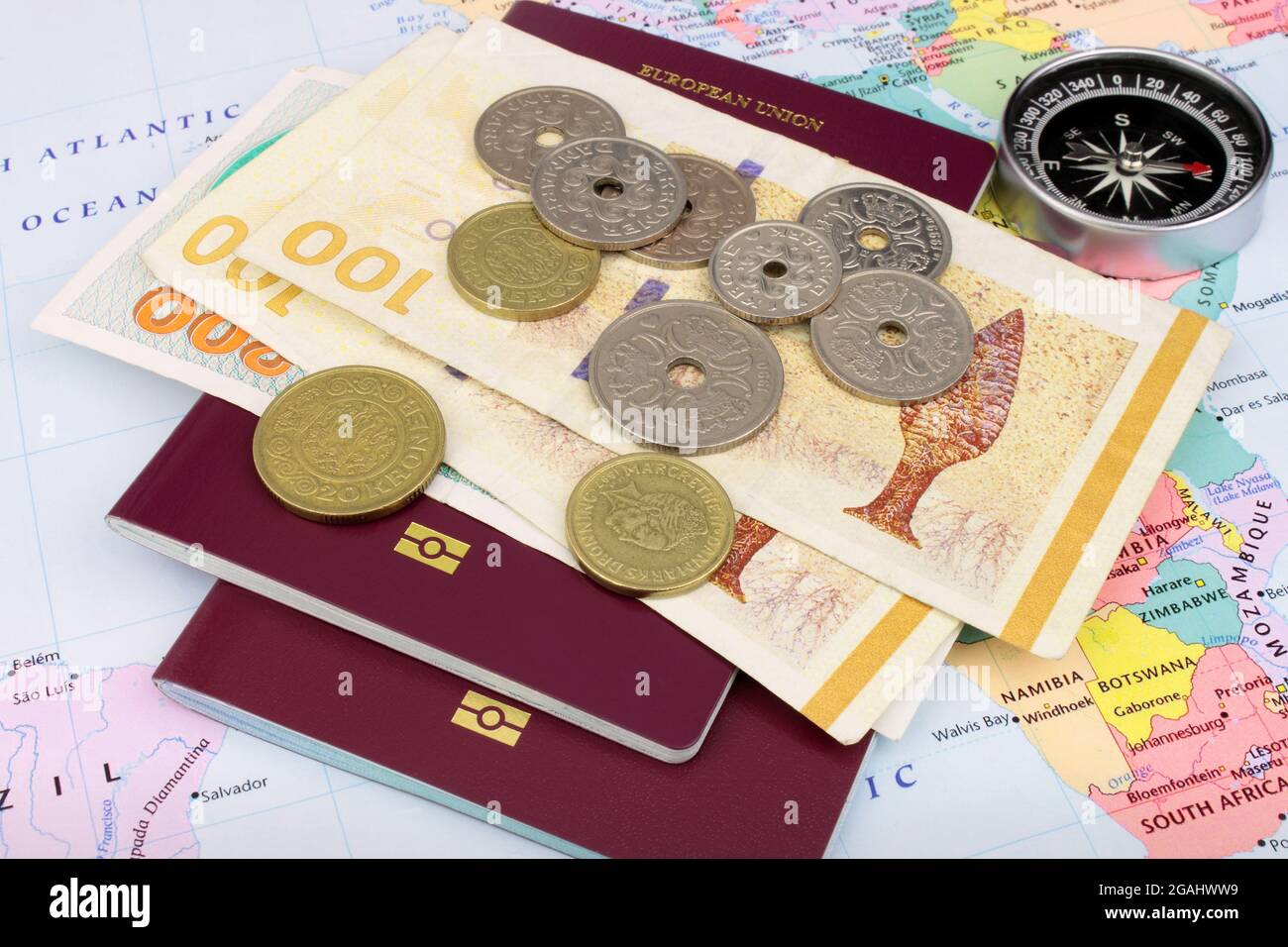 EU passports with Danish Kroner, a map and compass to symbolise travel ...