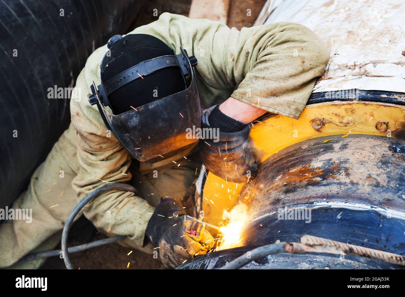 Repair of heating duct. The workers, welders made by electric welding ...