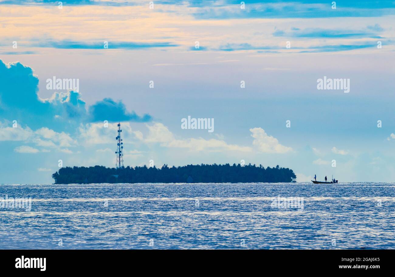 Small island in tropical sea against sky with clouds background.The ...