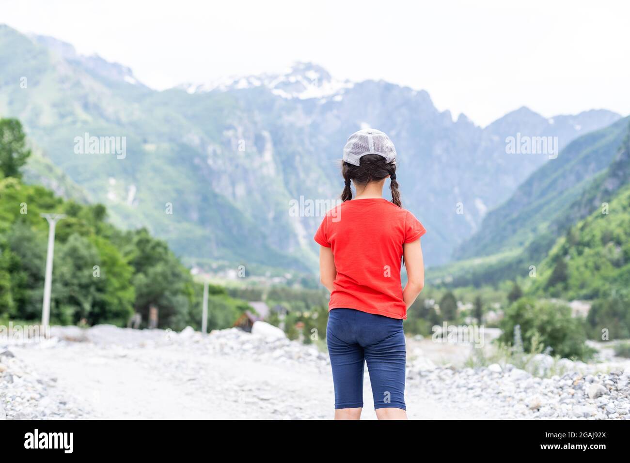 Portrait of a cute little girl in mountains Stock Photo - Alamy
