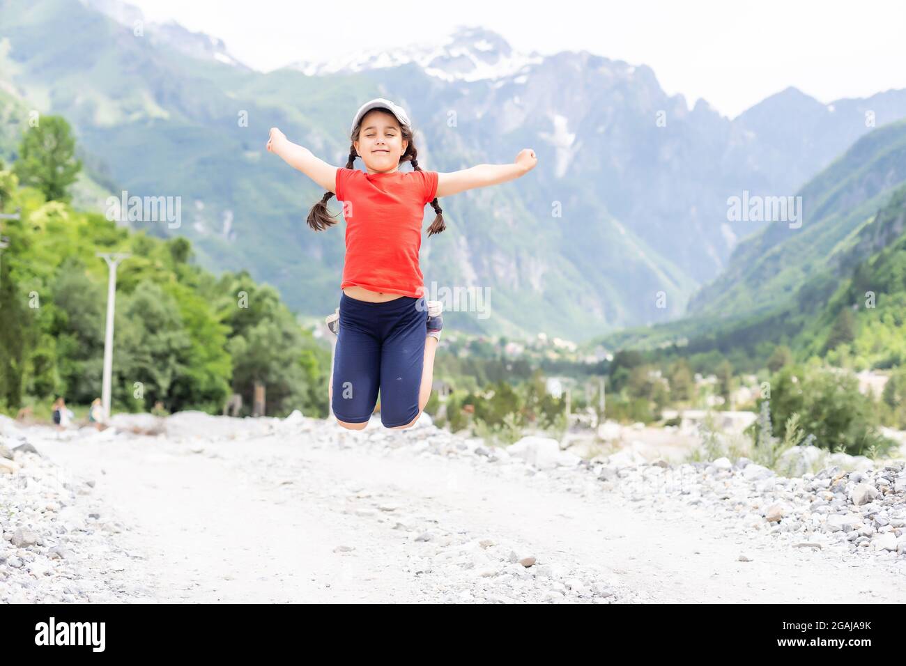 Portrait of a cute little girl in mountains Stock Photo - Alamy