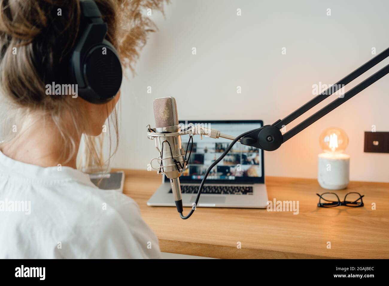 Woman podcaster streaming and broadcasting her podcast from homemade ...