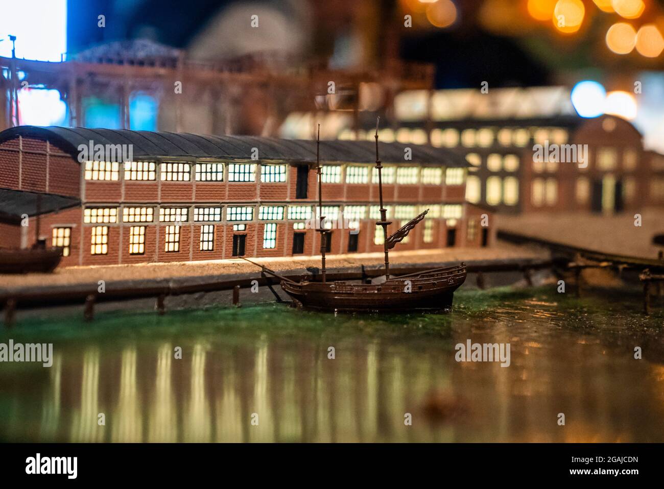 Small train model city where train goes near warehouses Stock Photo - Alamy
