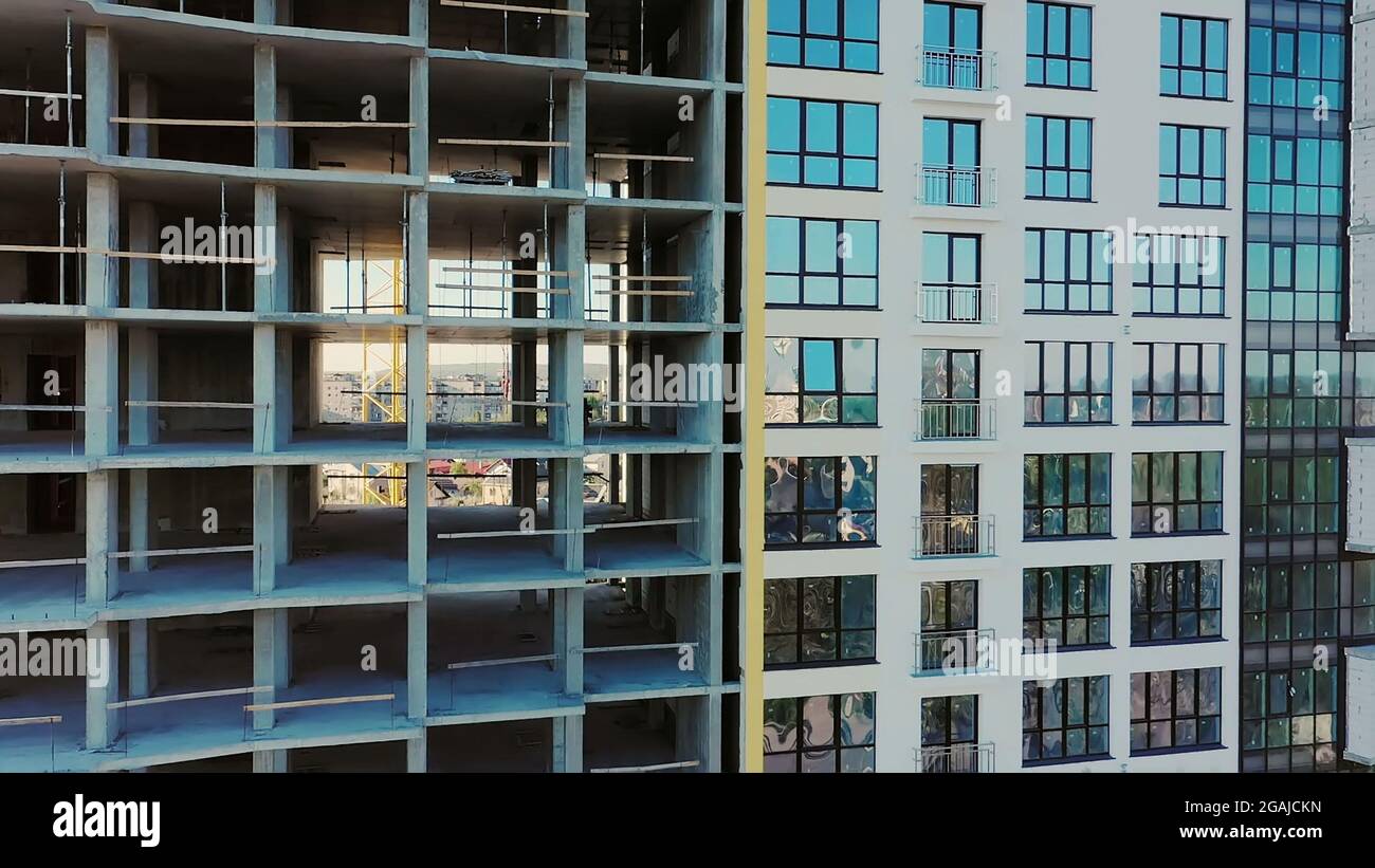 Many windows on new apartment building facade under construction. Real ...