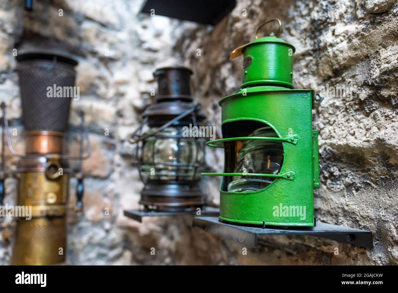 Old ship green lantern hanging on the wall Stock Photo - Alamy