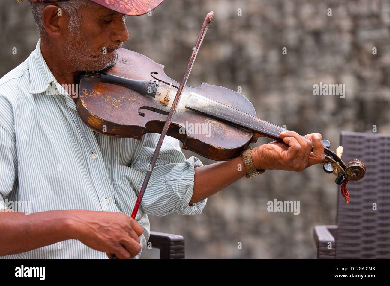 Man Playing Violin Sitting