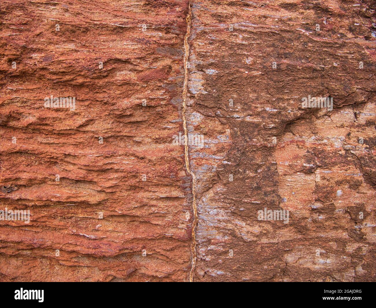 Red laterite rock at Giants Causeway on the Antrim Coast in Northern ...