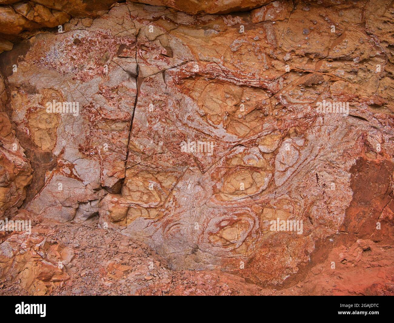 Red laterite rock at Giants Causeway on the Antrim Coast in Northern ...