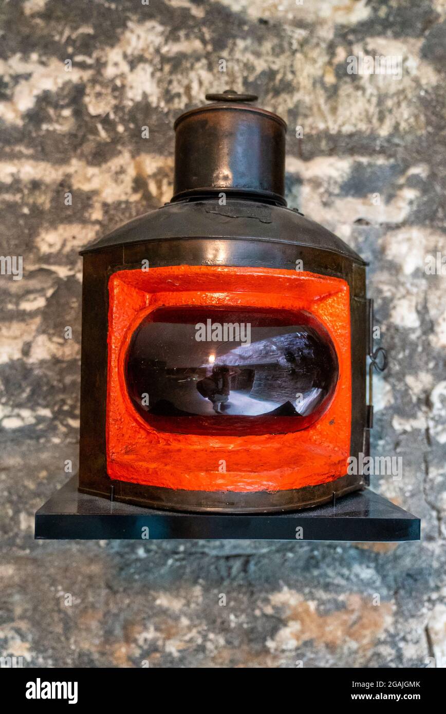 Old ship red lantern hanging on the wall Stock Photo - Alamy