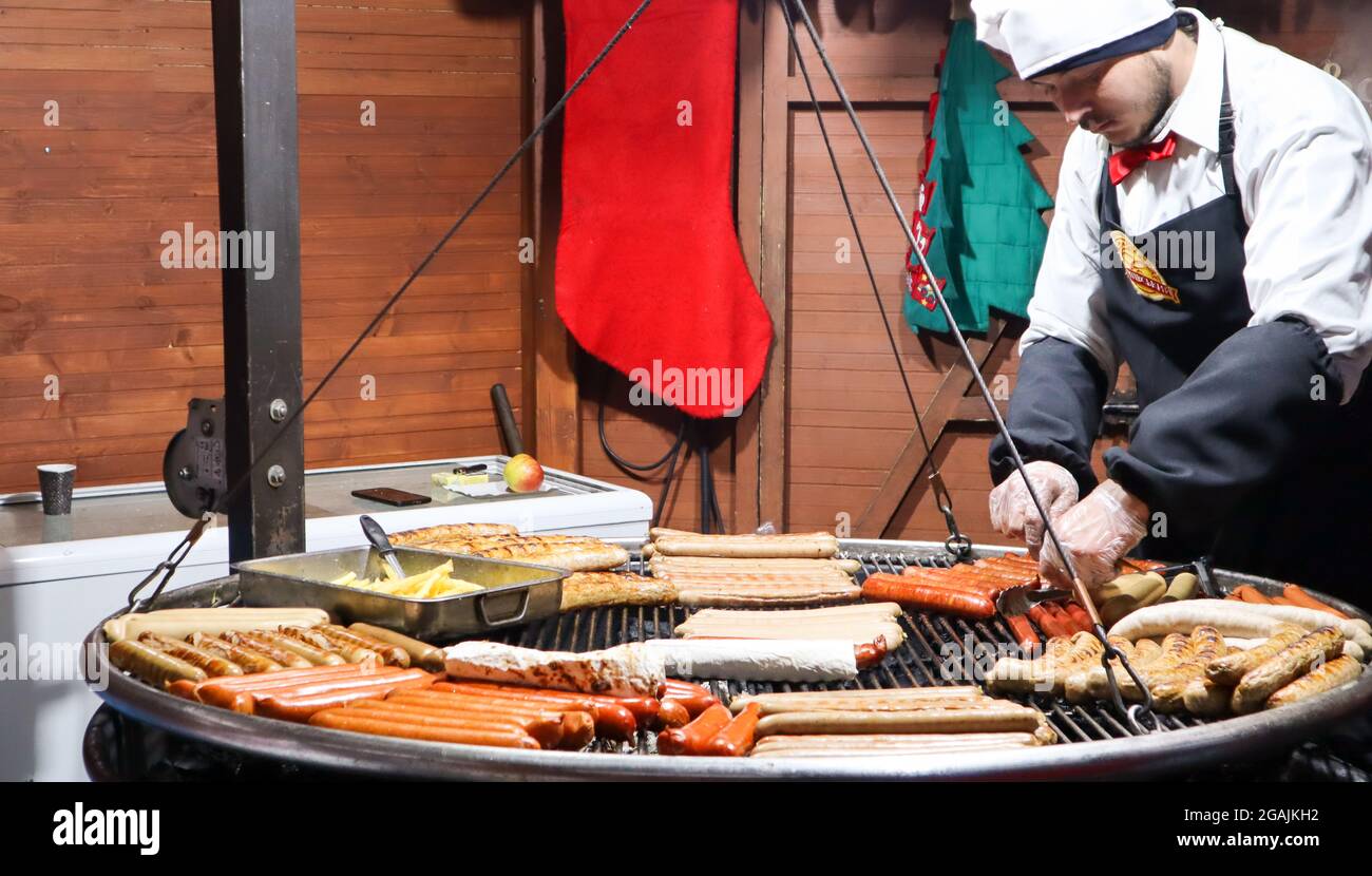 Ukraine, Kiev - January 3, 2019: a chef cooks a barbecue on the grill ...