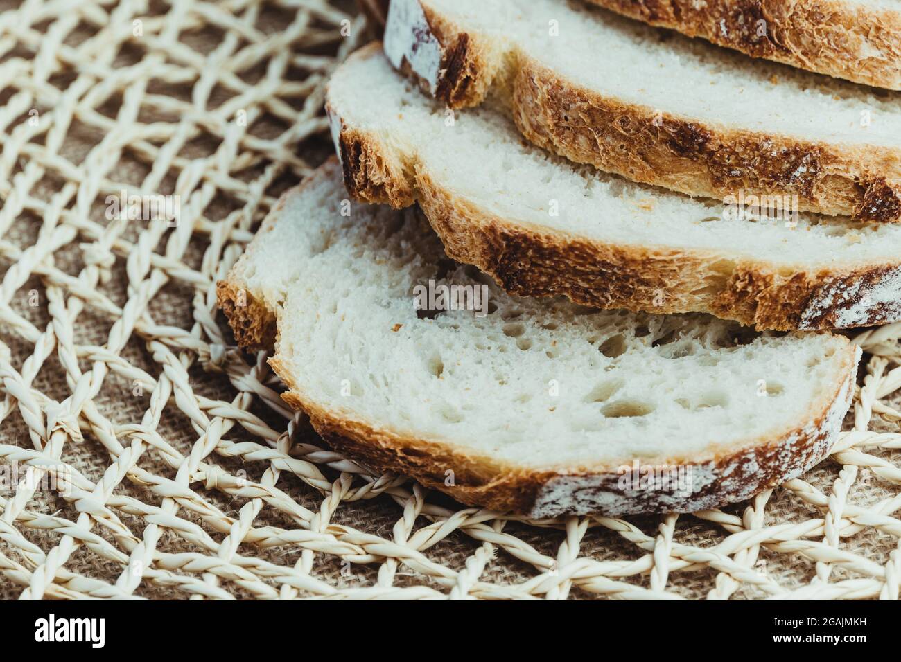 Background of sourdough bread slices on a rustic wire rack Stock Photo ...