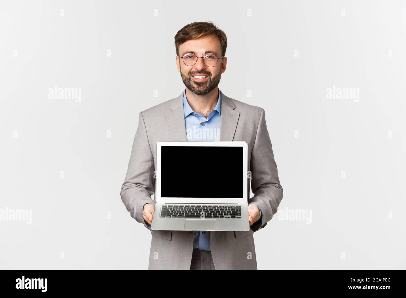 Portrait of smiling businessman with beard, wearing glasses and suit ...
