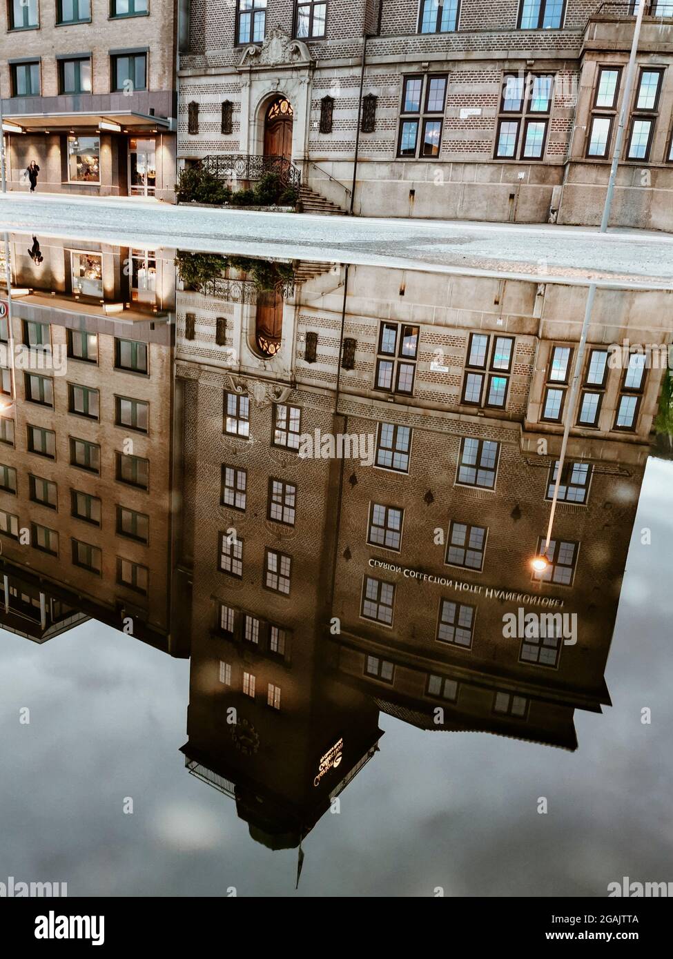 BERGEN, NORWAY - May 16, 2021: The buildings reflecting in the wet ...