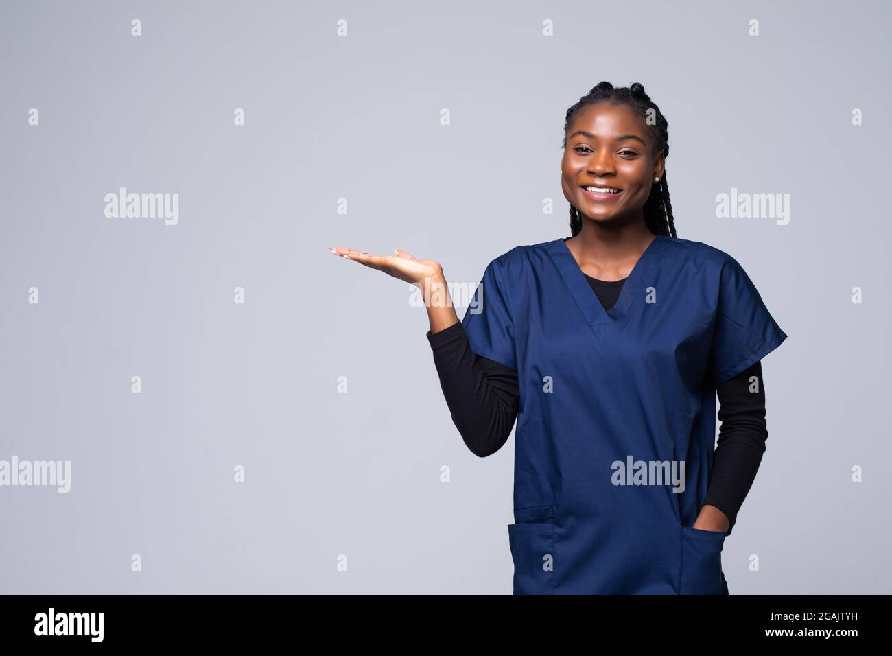 Young african american doctor woman over isolated white background open ...