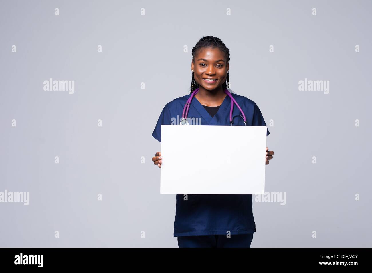 African doctor woman, medical professional working holding blank ...