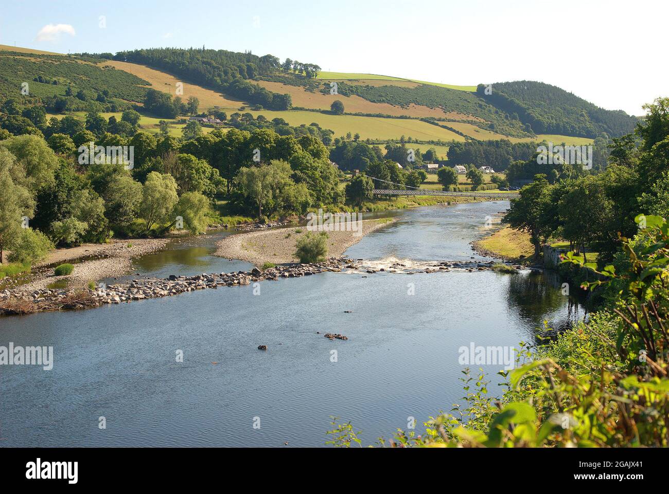 view of river Tweed hills and chain bridge at Melrose in summer Stock ...