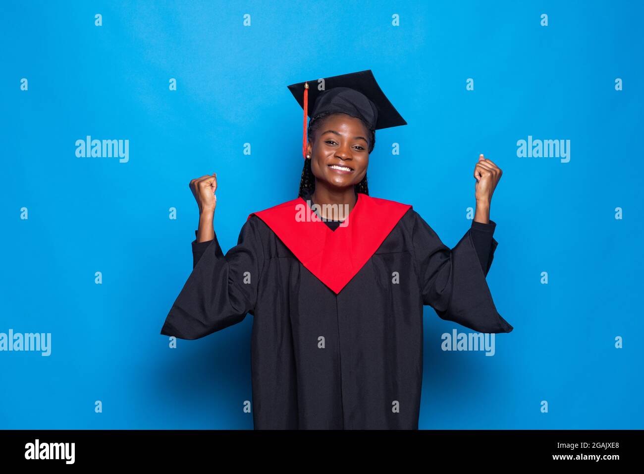 Happy african student with graduation hat and diploma isolated on blue ...