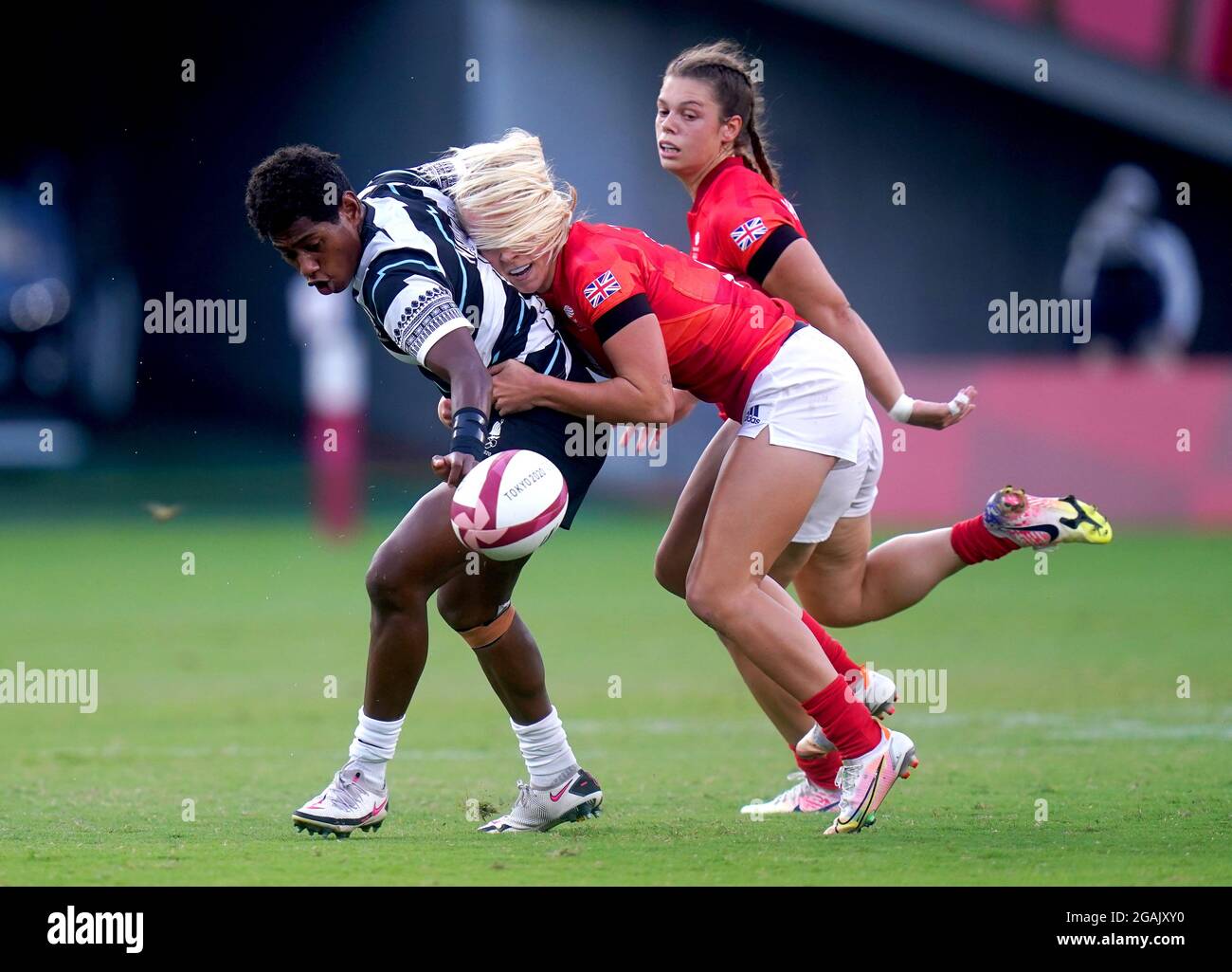 Fiji's Ana Maria Naimasi (left) is tackled by Great Britain's Emma Uren ...