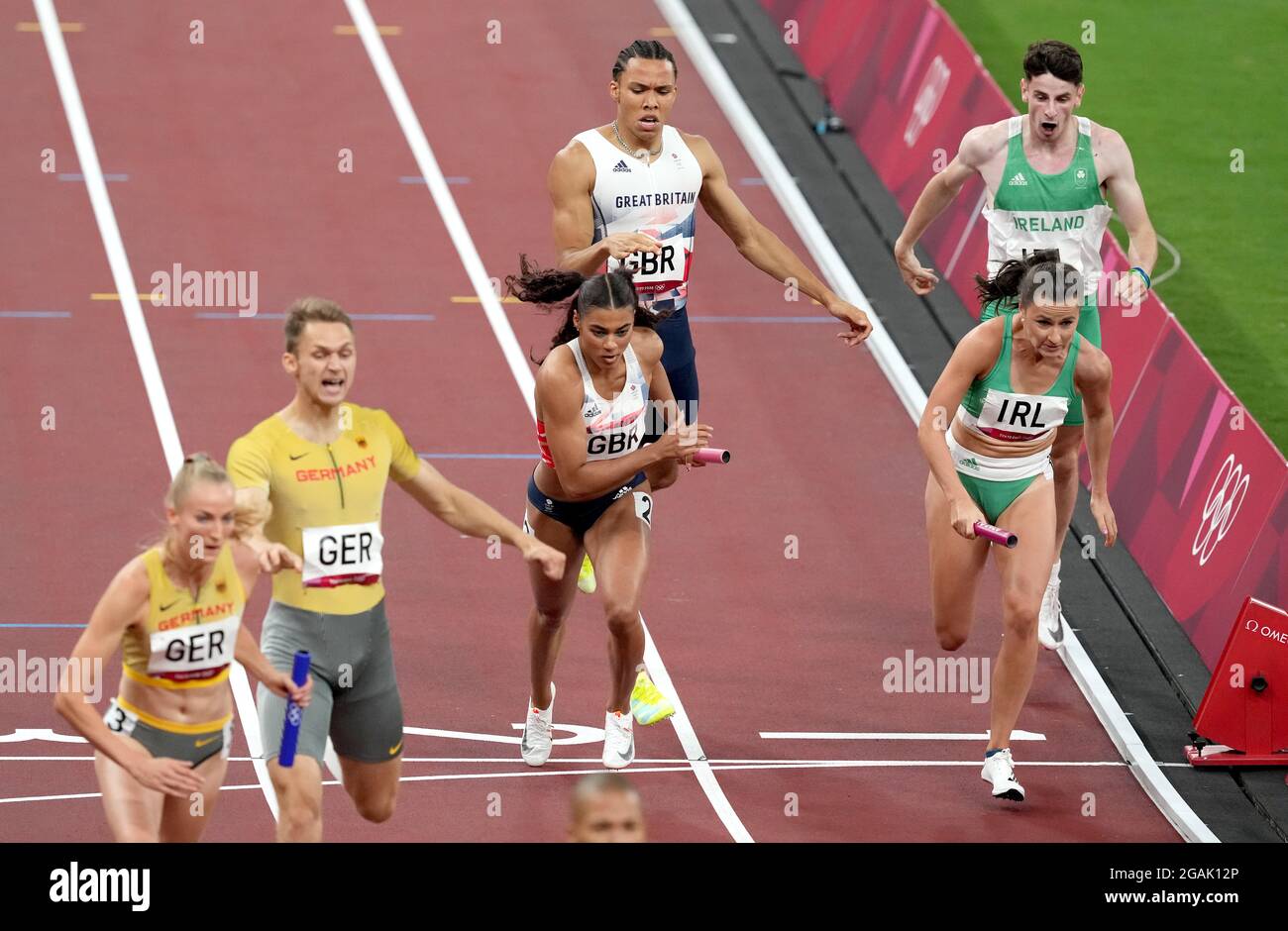 Great Britain's Nicole Yeargin (front centre) receives the baton from ...