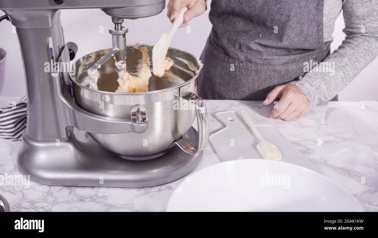 Step by step. Mixing ingredients in standing kitchen mixer to bake ...