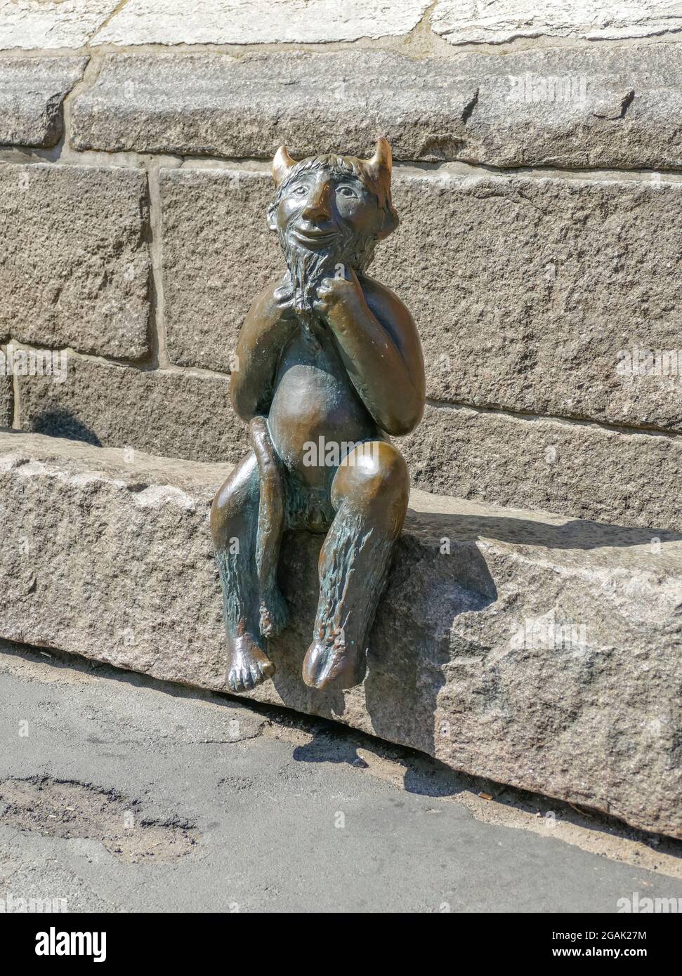 small metallic devil sculpture seen in Luebeck, a hanseatic city in ...
