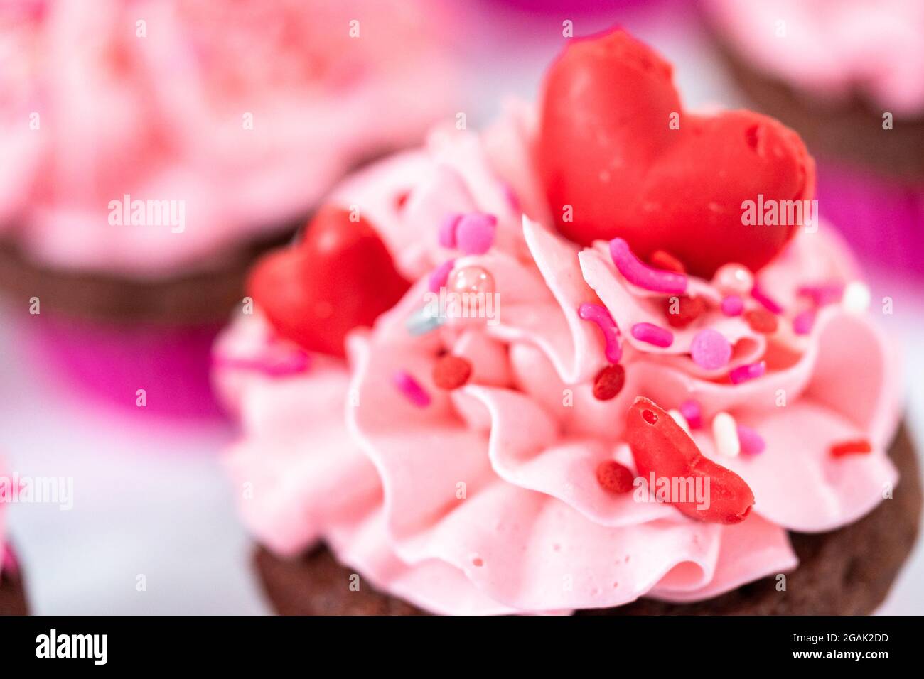 Red velvet cupcakes with pink Italian buttercream frosting and ...