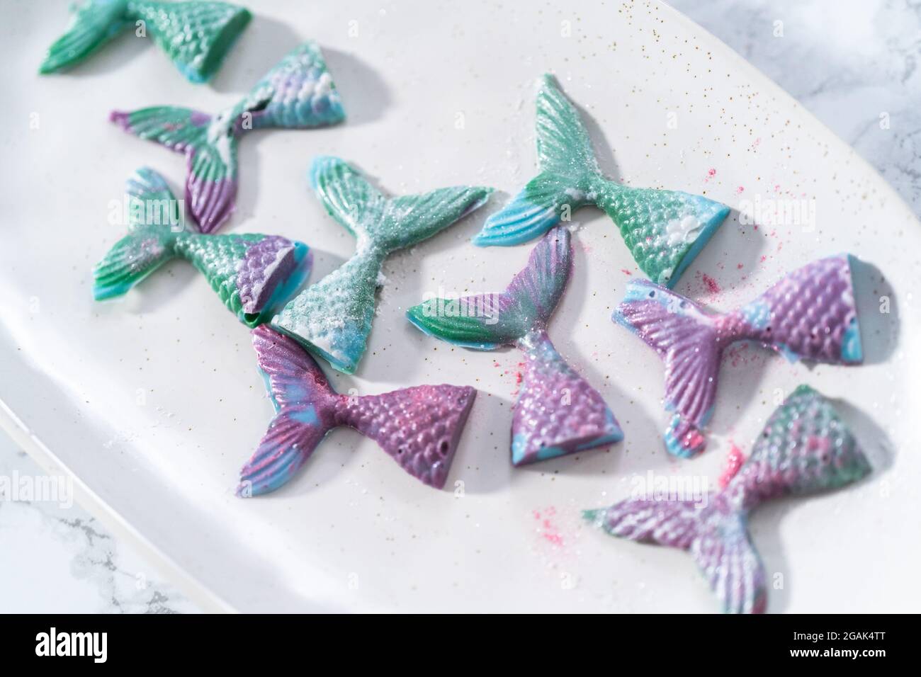 Homemade chocolate mermaid tails covered with glitter dust Stock Photo ...