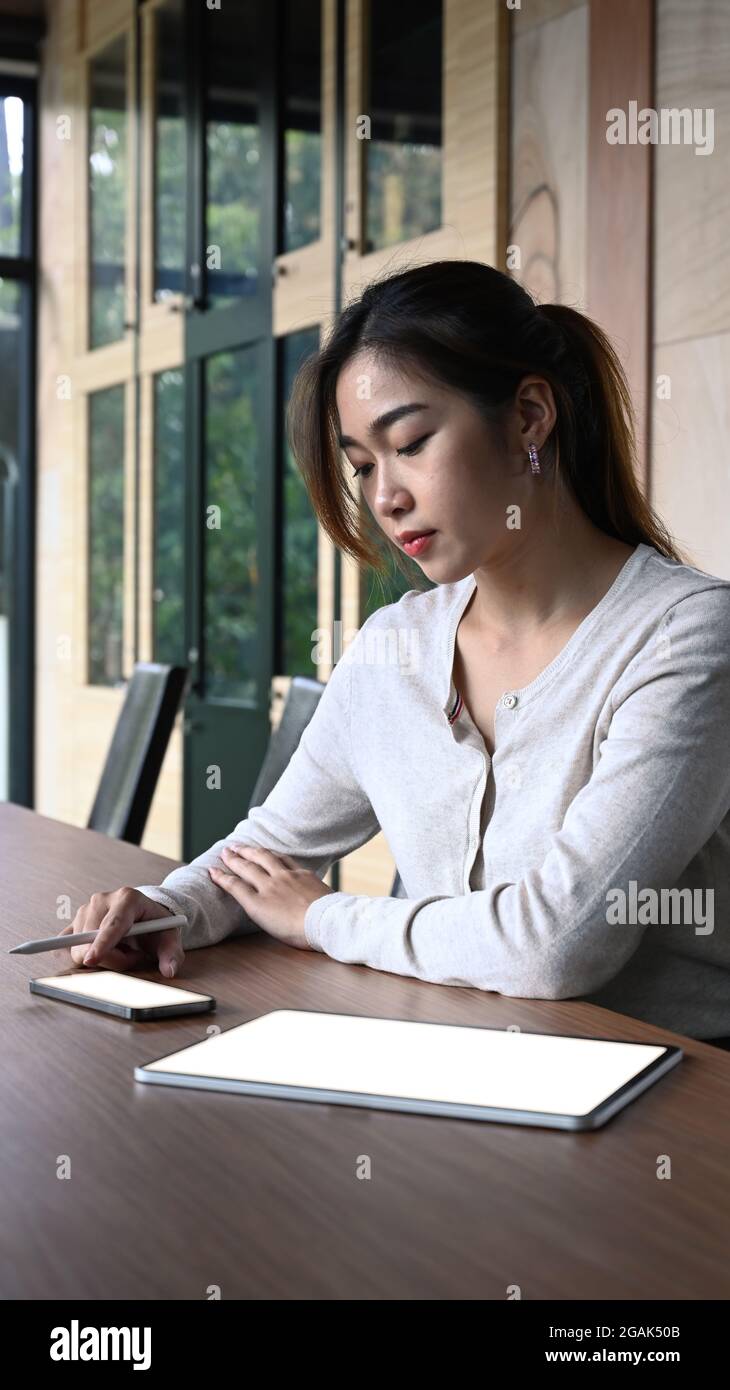 Female designer using mobile hi-res stock photography and images - Alamy