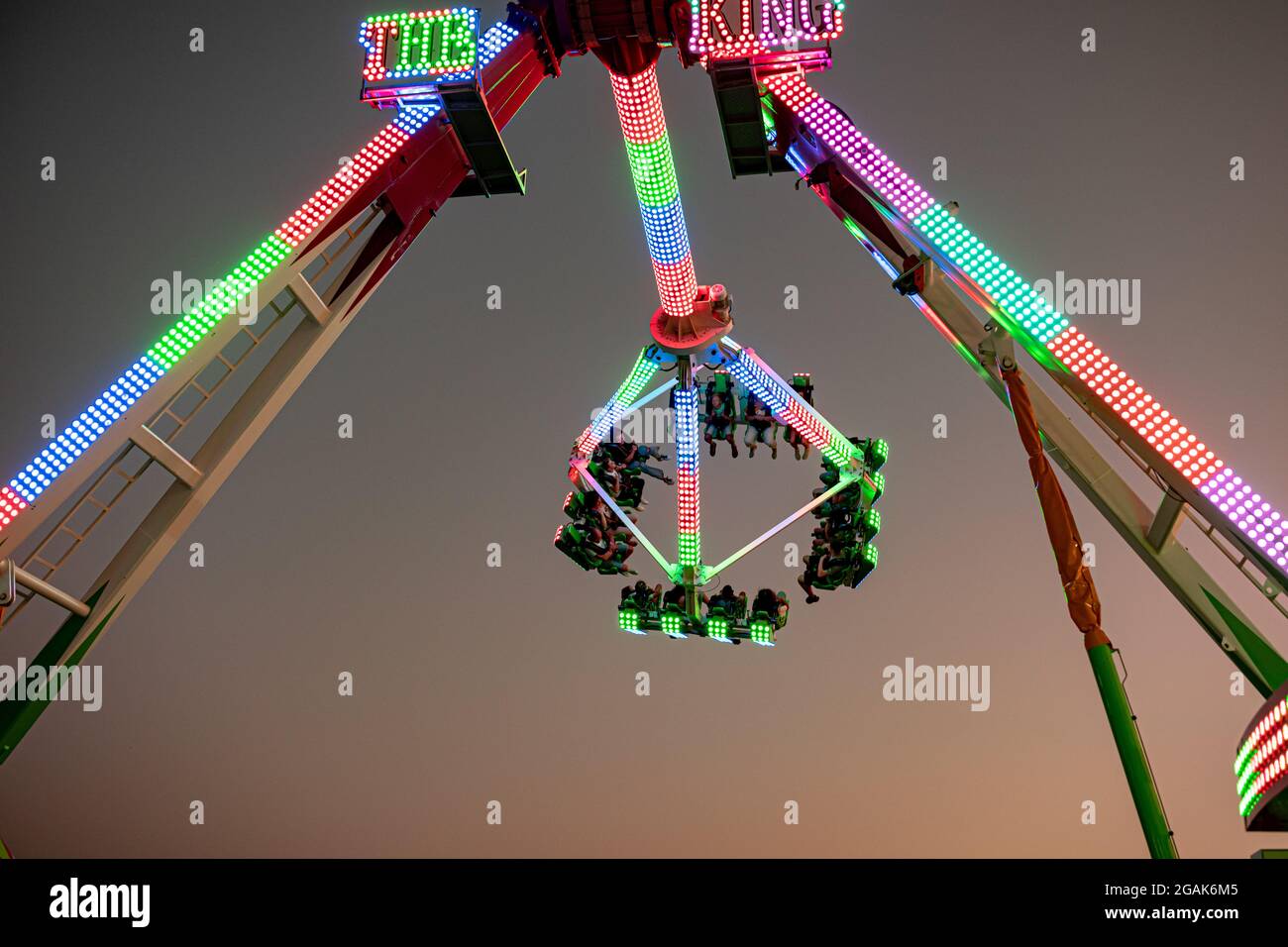 ferris wheel and attraction close-up in flight Stock Photo - Alamy