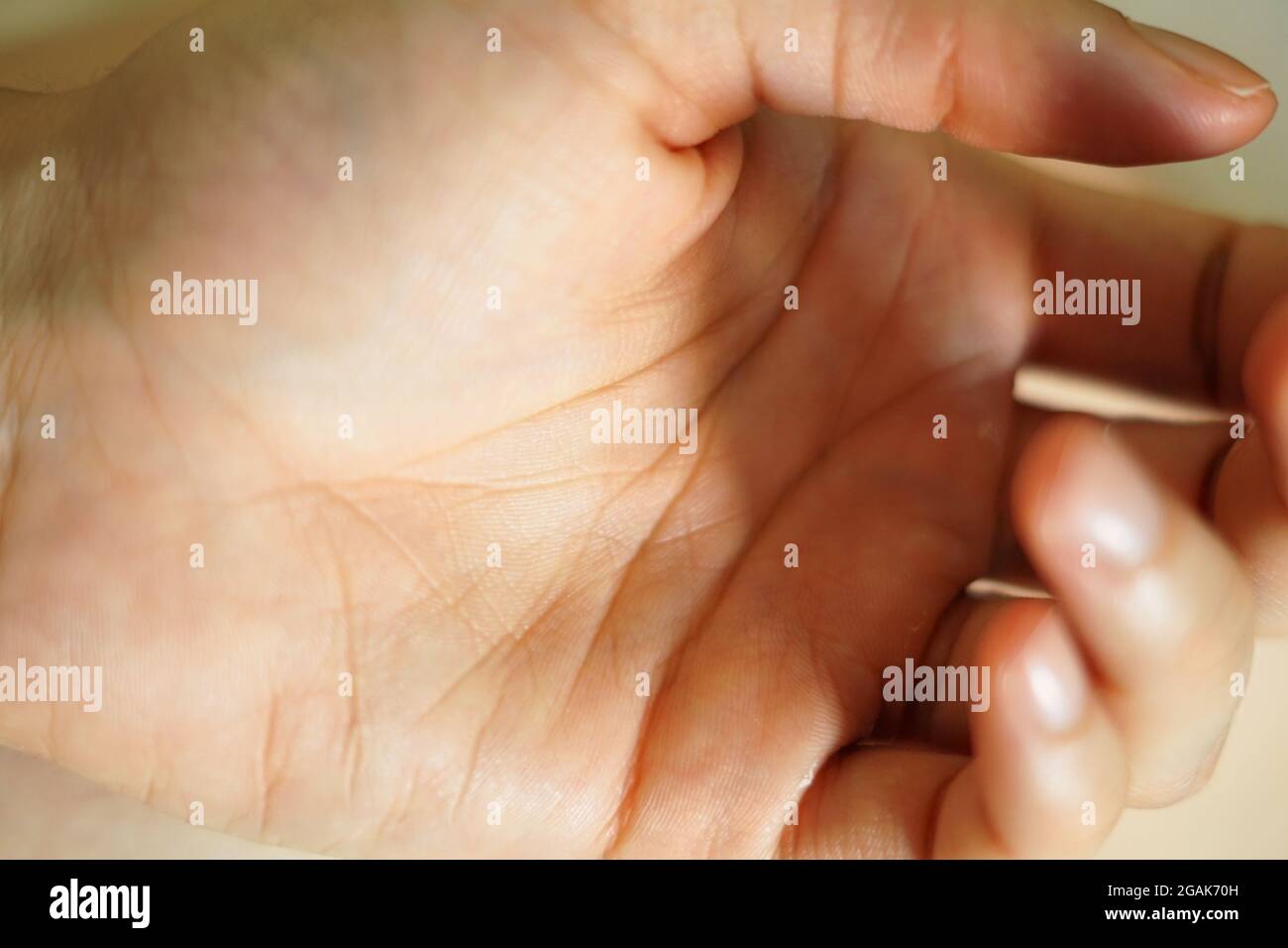 Fingers folded into palm hi-res stock photography and images - Alamy
