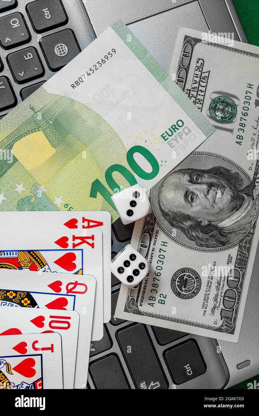 Chisinau, Moldova - 20. 12. 2020 dice, playing cards on laptop keyboard ...