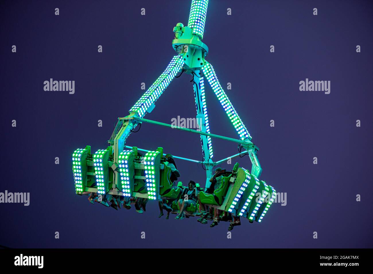 ferris wheel and attraction close-up in flight Stock Photo - Alamy