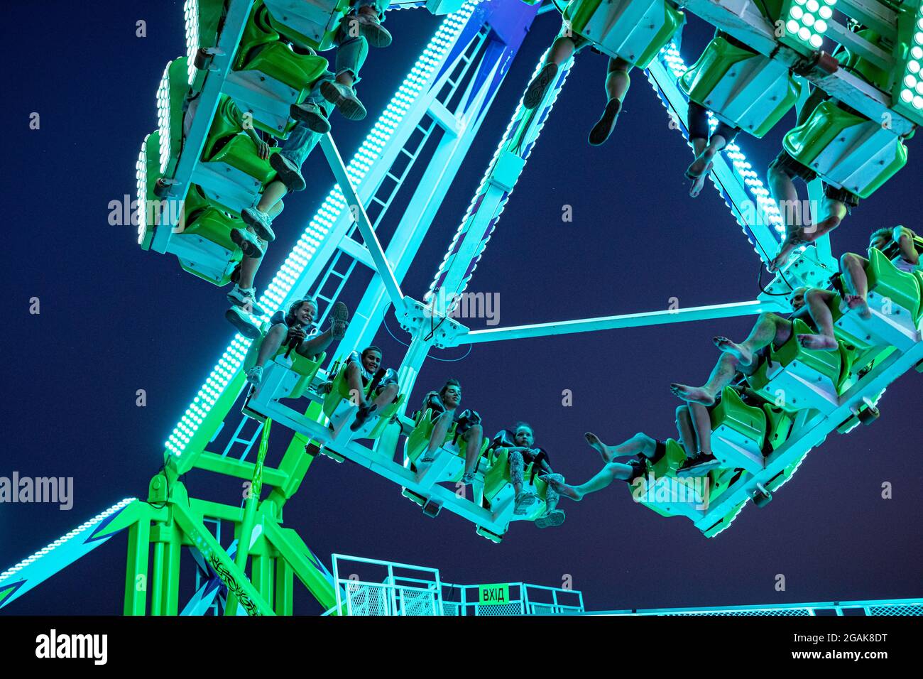 ferris wheel and attraction close-up in flight Stock Photo - Alamy