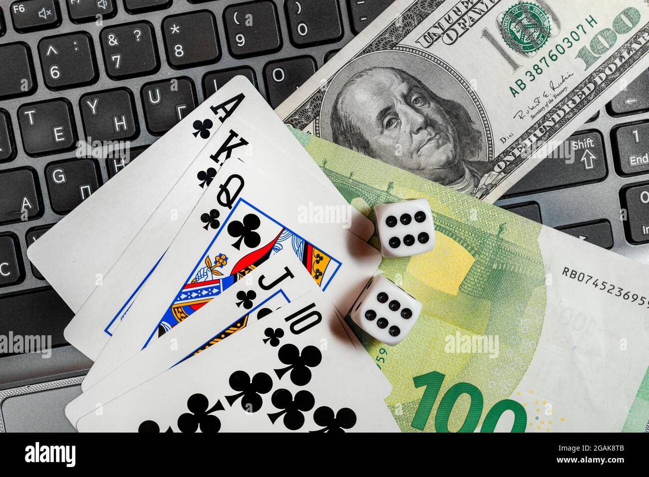 Chisinau, Moldova - 20. 12. 2020 dice, playing cards on laptop keyboard ...