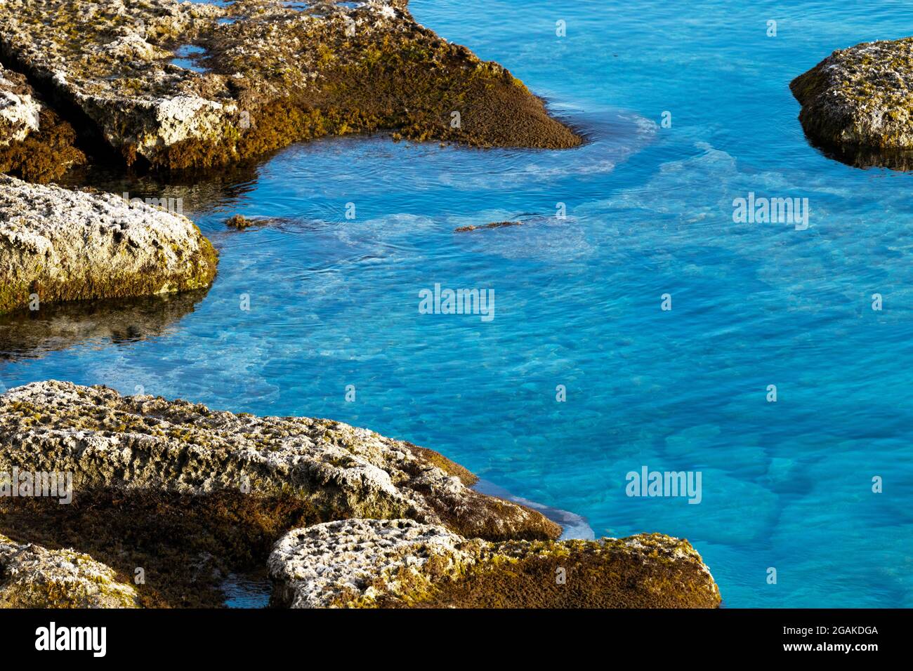 Mediterranean sea beach. Stones and Rocks. Summer day seascape. Clear ...